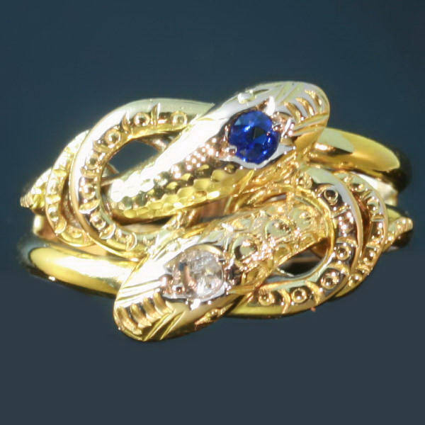 Victorian serpents ring, embracing snakes set with rose cut diamond and ...
