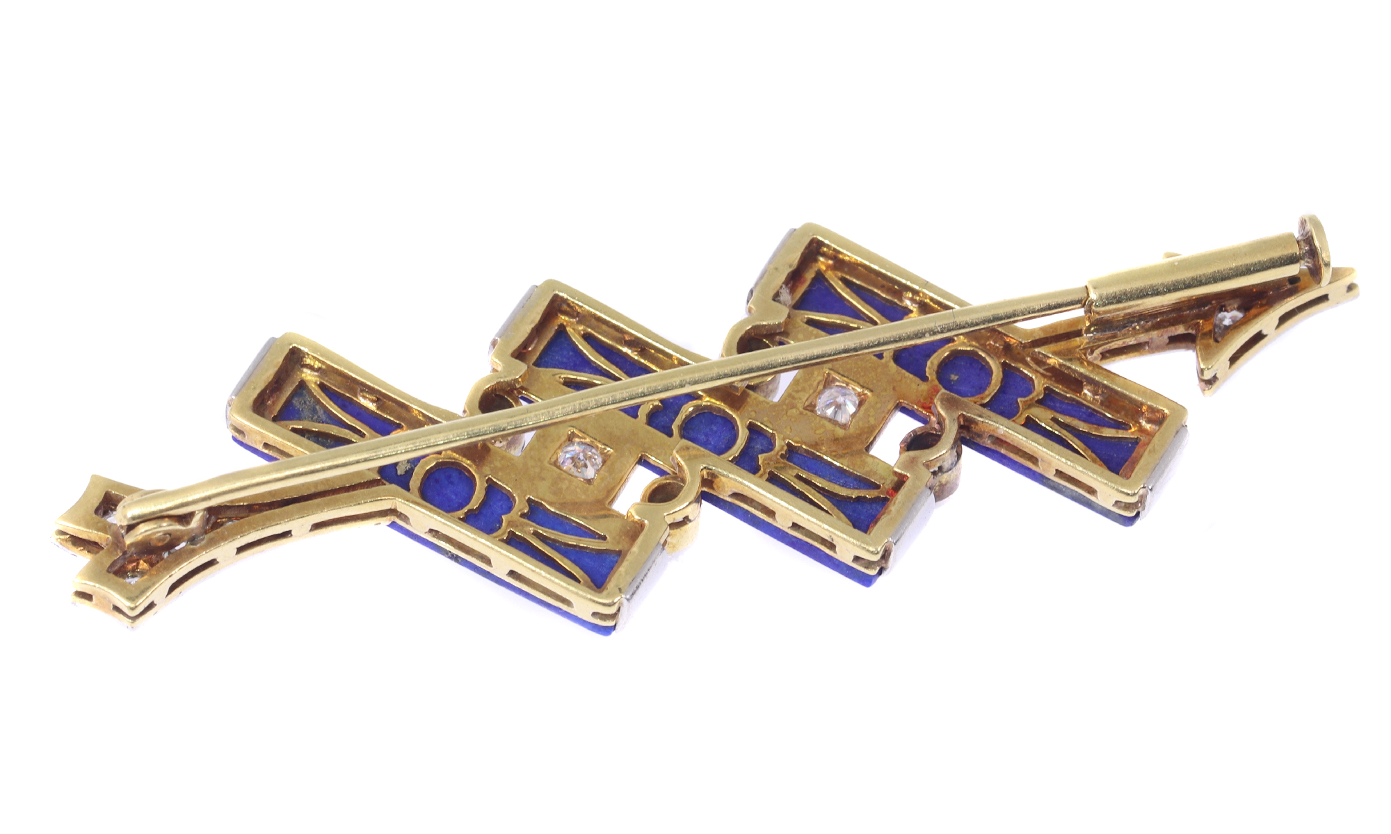 Diamond arrow brooch perforating three solid bars of lapis lazuli ...